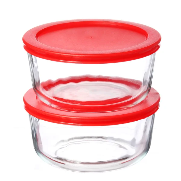 Glass food containers with red plastic lids isolated on white ...