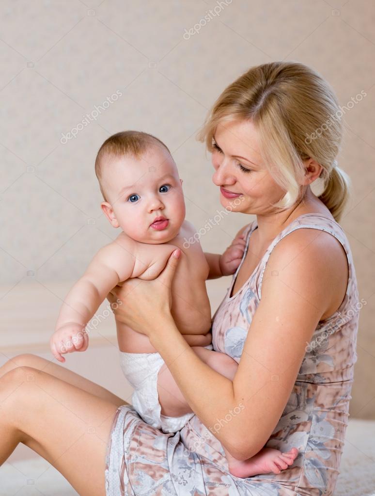 Mother holding baby boy — Stock Photo © oksun70 #14743463 Mother holding baby boy — Stock Photo © oksun70 #14743463