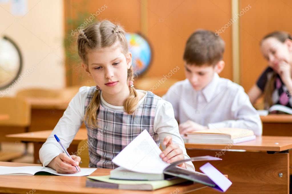 School kids at lesson — Stock Photo © oksun70 #31995549