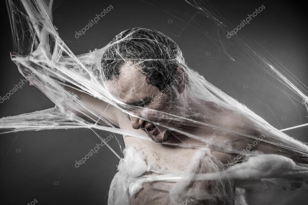 Man tangled in spider web Stock Photo by ©outsiderzone 40636711