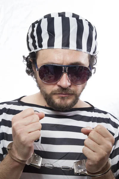 Man prisoner in prison garb Stock Photo by ©outsiderzone 82159618