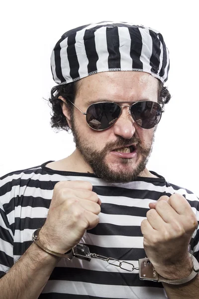 Man prisoner in prison garb Stock Photo by ©outsiderzone 41633033