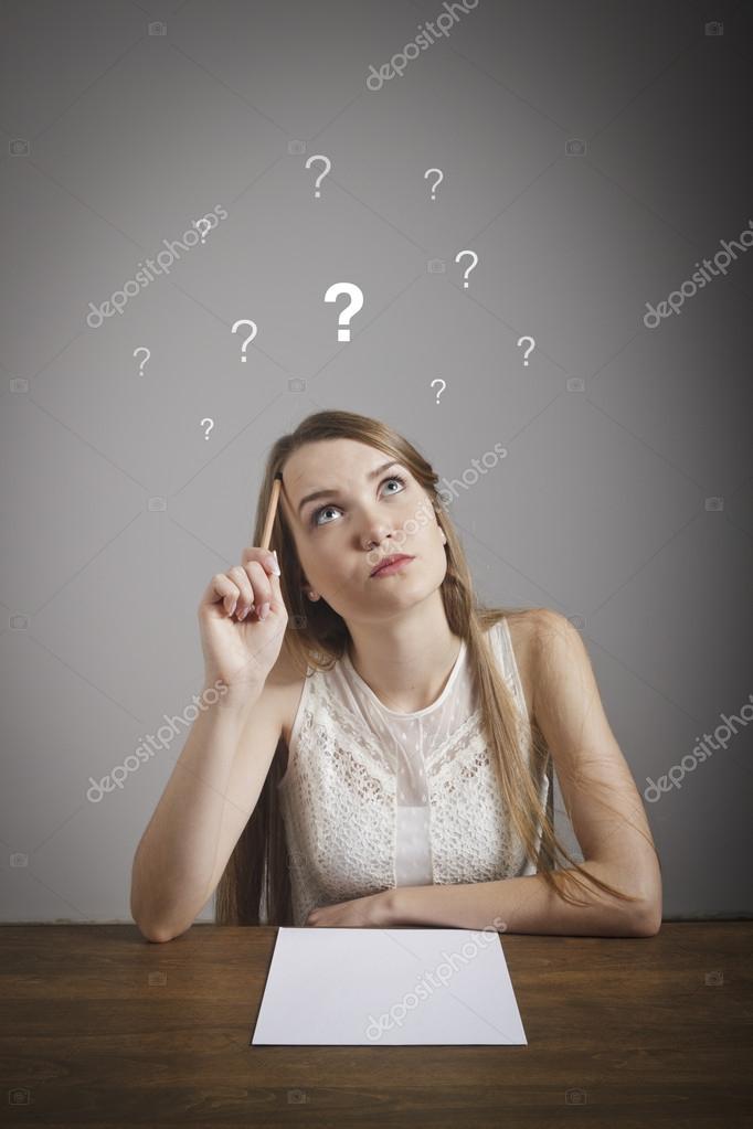 Girl in thoughts. Question marks. — Stock Photo © grassyone #40978097