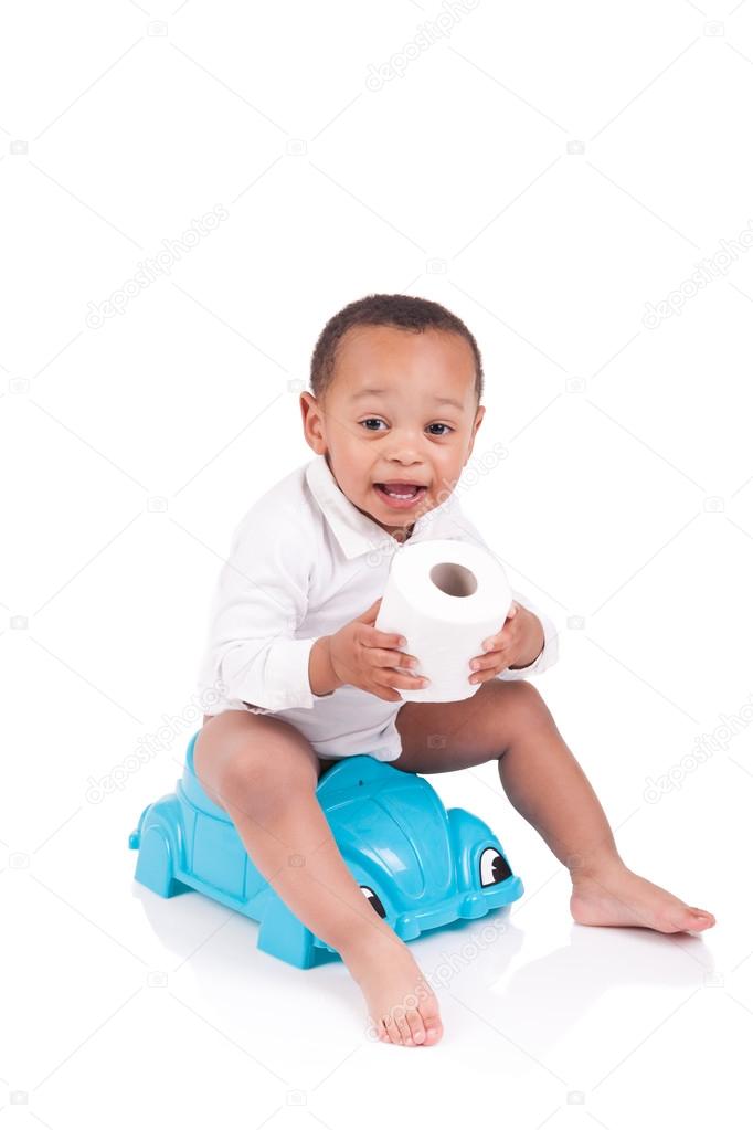 African child on potty play with toilet paper, isolated over whi Stock ...