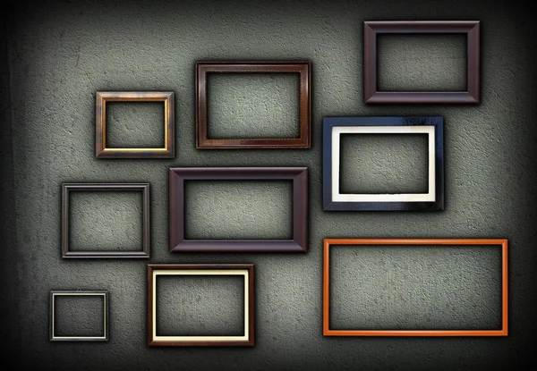 green grungy wall full of frames - Stock Image - Everypixel