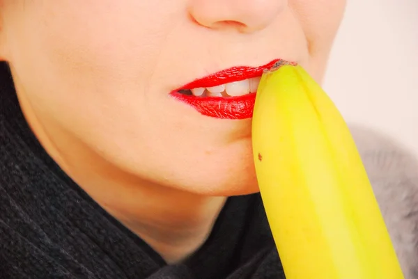Women eating banana Stock Photo by ©ia__64 3661643