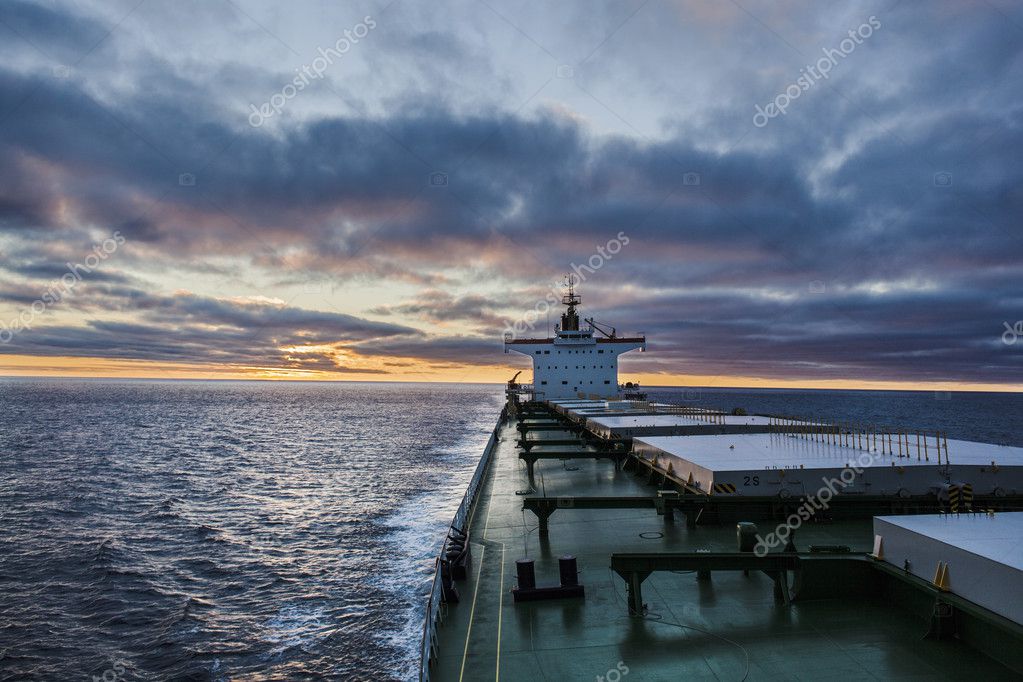 Cargo ship underway at sunset Stock Photo by ©nielubieklonu 48801687