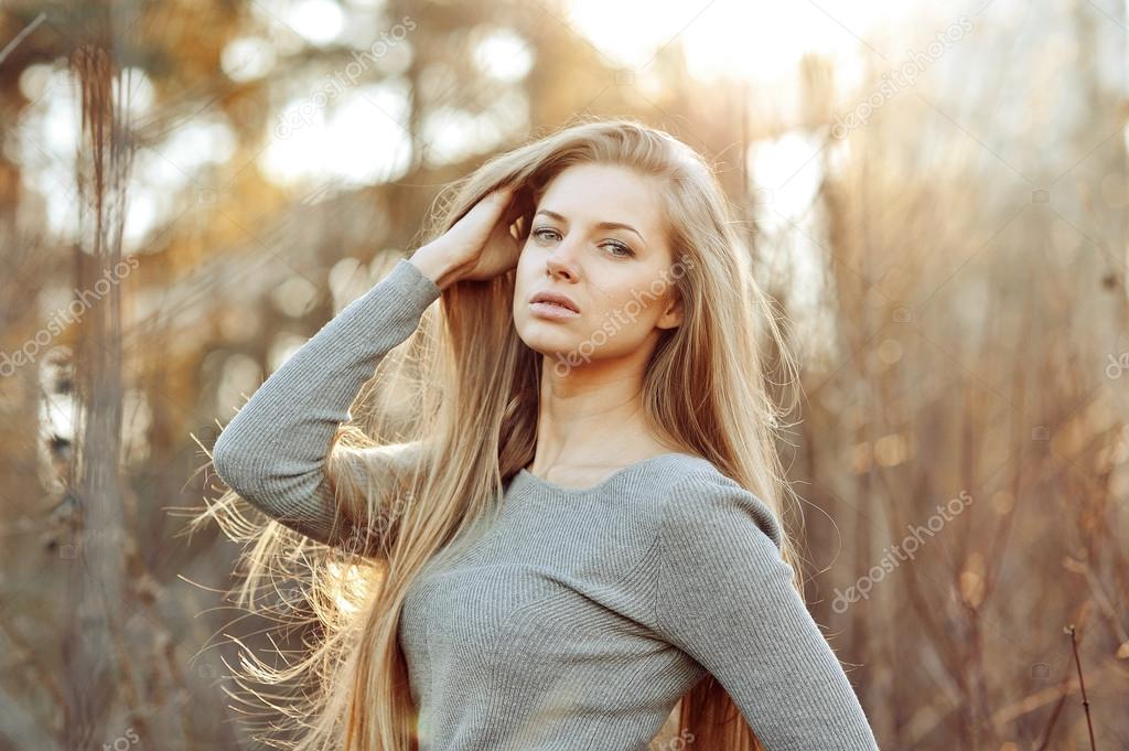 Beautiful blonde woman with perfect long chic hair Stock Photo by ...