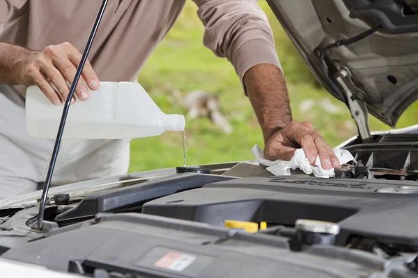 Filling the windshield washer fluid - Stock Image - Everypixel