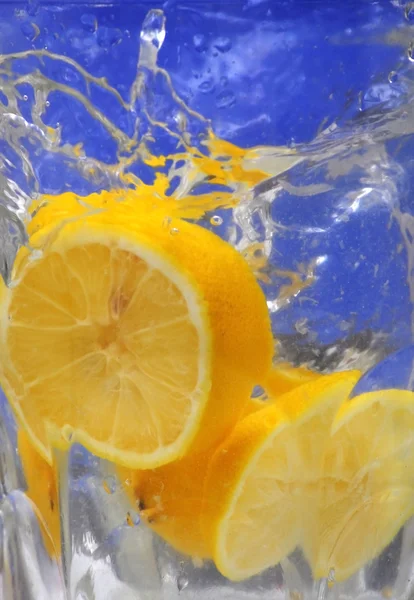 Lemon is dropped into water ⬇ Stock Photo, Image by © vitcom #1498732