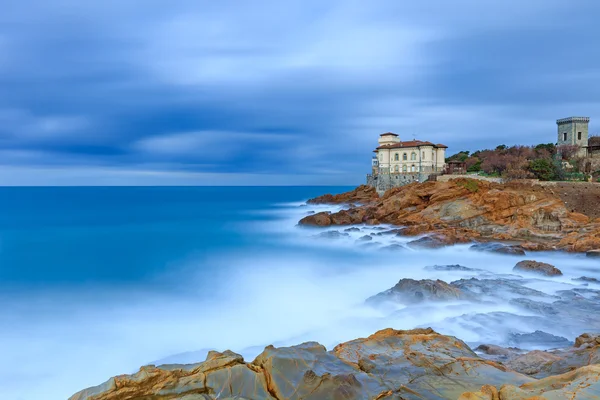 Boccale castle landmark on cliff rock and sea. Tuscany, Italy. Long ...