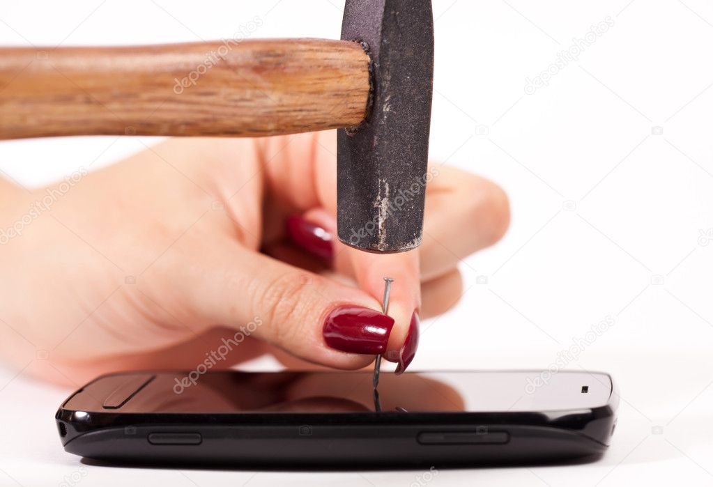 Hammer in hobnail into cellphone on white background Stock Photo by ...