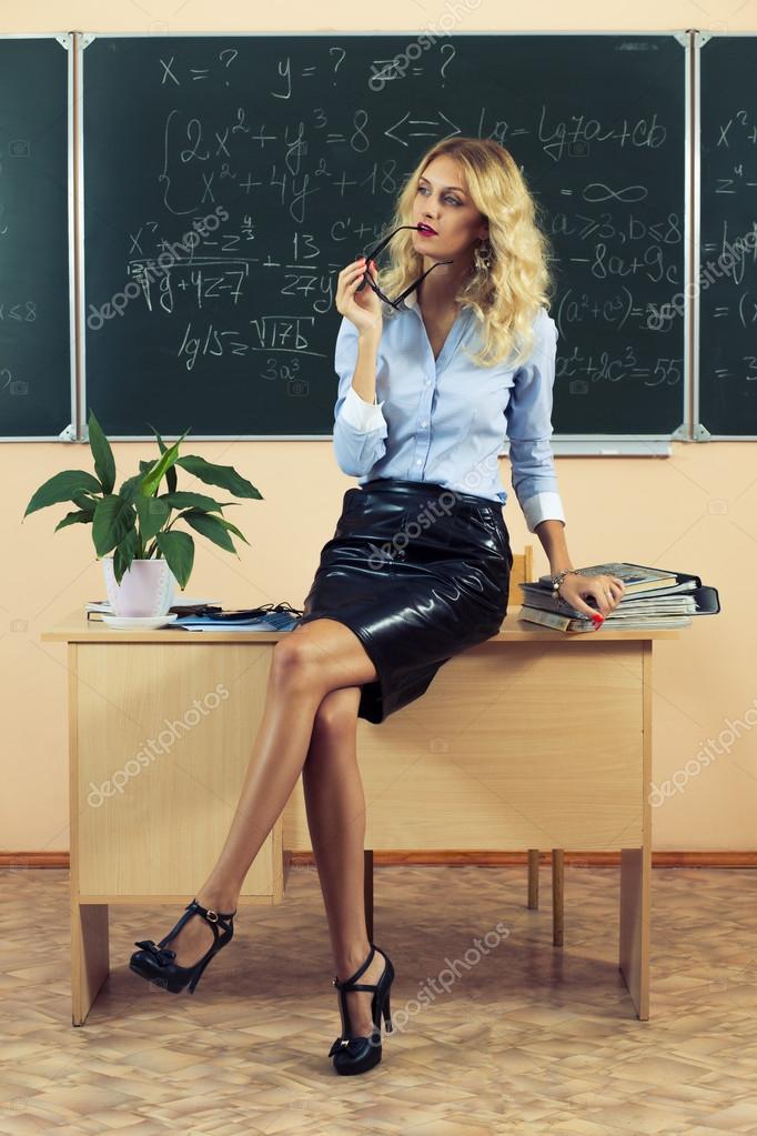 Young pretty teacher resting — Stock Photo © Aksakal #37020375 Young pretty teacher resting — Stock Photo © Aksakal #37020375