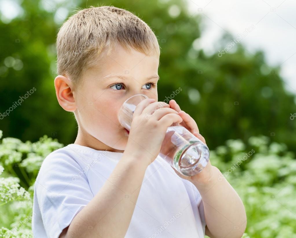 Child drinking pure water Stock Photo by ©maxoidos 44946821