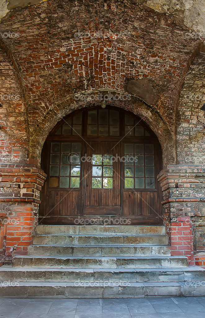 Facade of the ancient brick building with an arch Stock Photo by ...