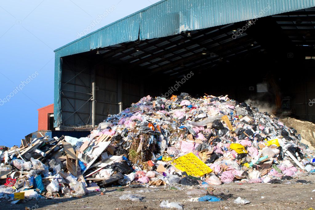 Rubbish piled up at a waste management centre — Stock Photo ...