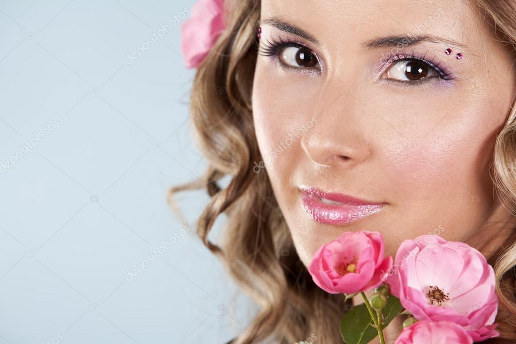 Beautiful face with pink roses Stock Photo by ©zdenkam 33617509