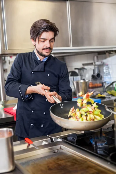 Chef cooking a vegetables - Stock Image - Everypixel