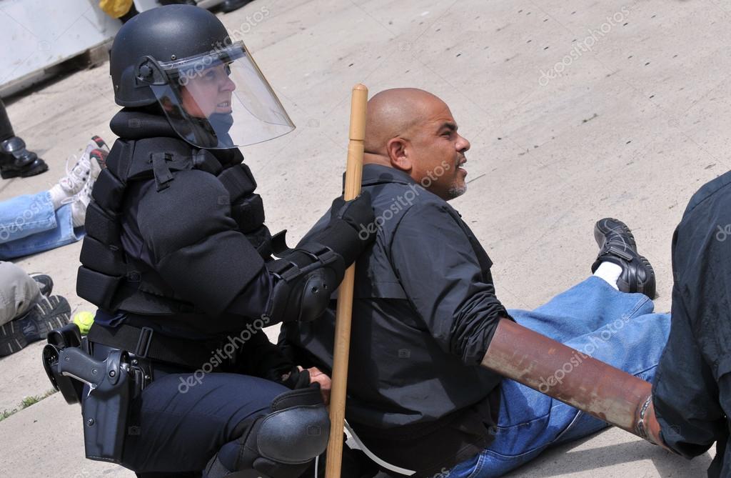 Police Officers in full protective gear respond to a civil disturbance ...