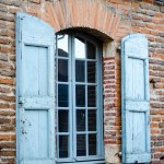 French window with blue shutters — Stock Photo © rixipix #2429790