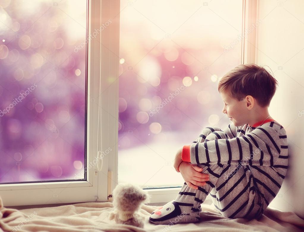 Boy in winter window — Stock Photo © Alekuwka #39321245