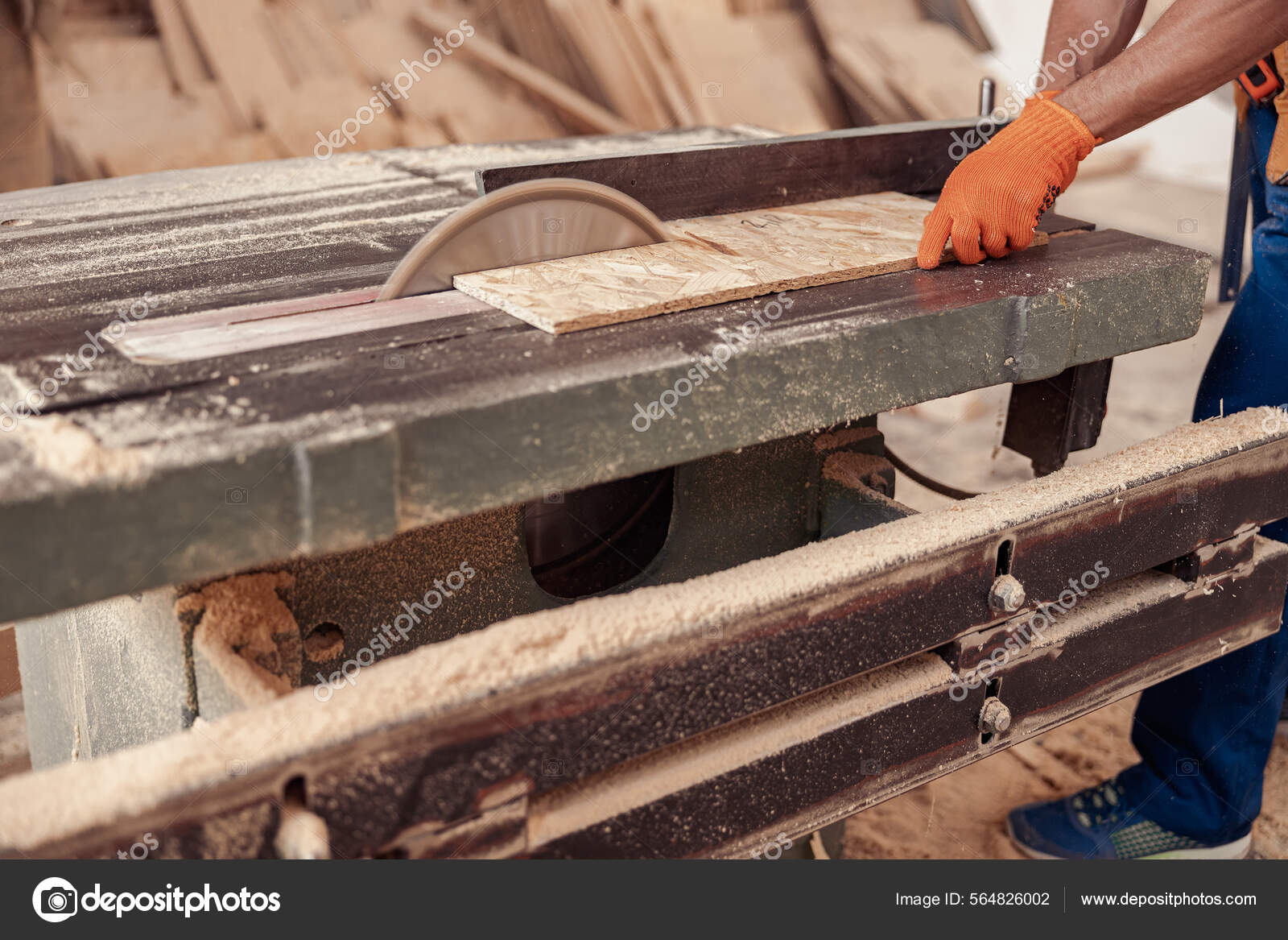 Male worker using circular saw machine in workshop Stock Photo by ©dima ...