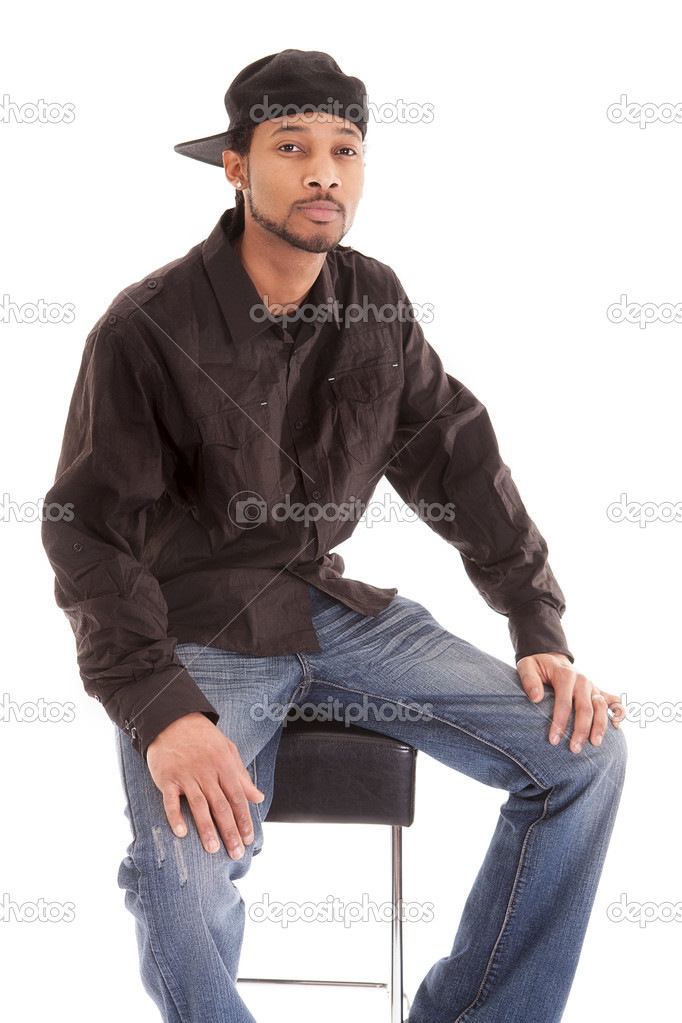 Rapper guy sitting on bar stool — Stock Photo © Quasarphoto #19233373