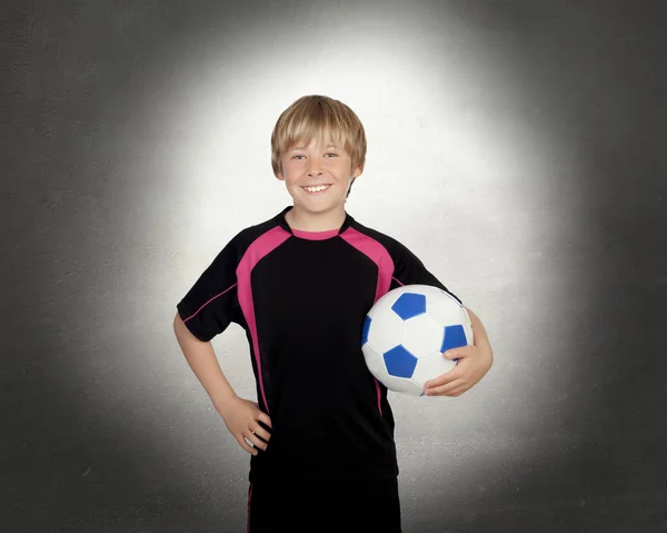 Preteen with a uniform for play soccer Stock Photo by ©Gelpi 24343635