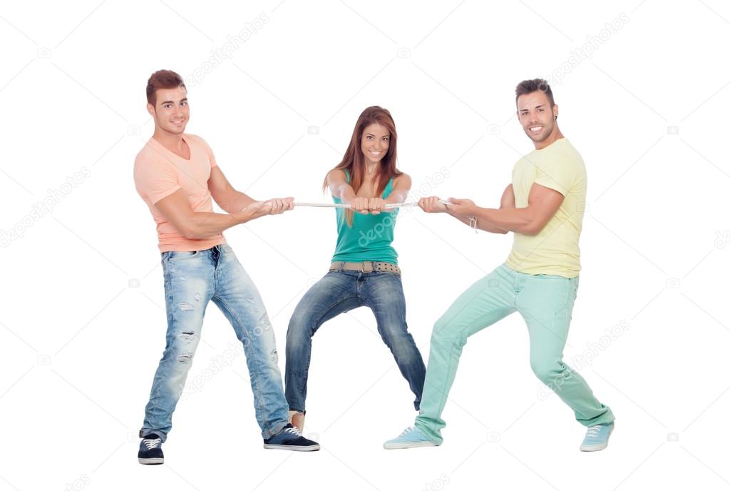 Two guys competing for a girl pulling a rope — Stock Photo © Gelpi ...