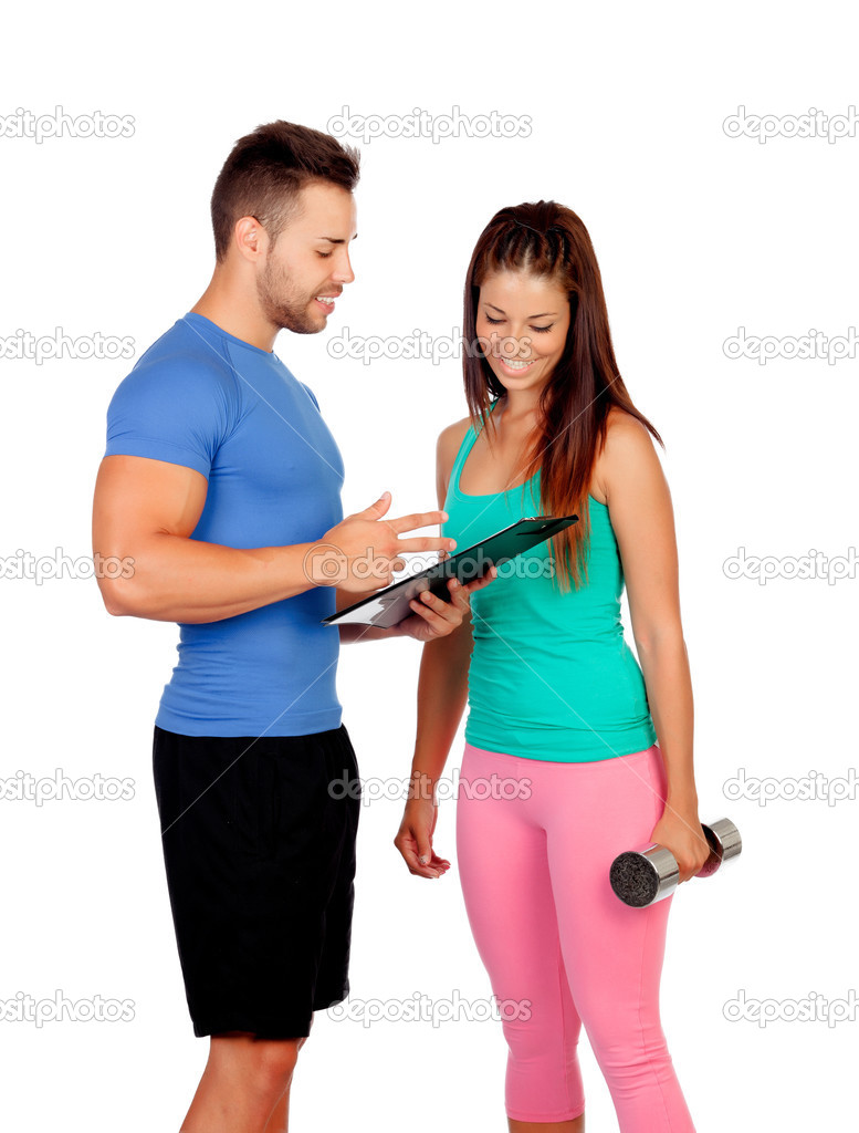 Handsome personal trainer with a attractive girl Stock Photo by ©Gelpi ...