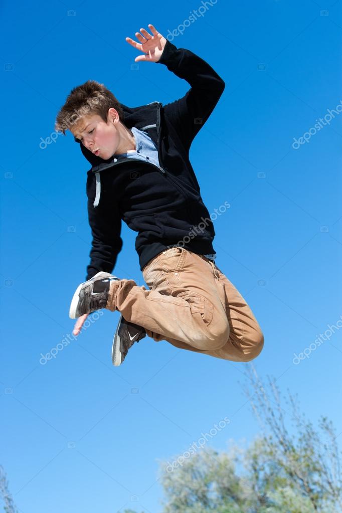 Energetic boy jumping. Stock Photo by ©karelnoppe 25452771