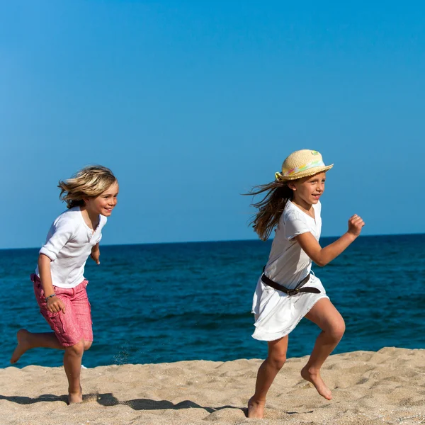 Two kids running together outdoors. Stock Photo by ©karelnoppe 26711405