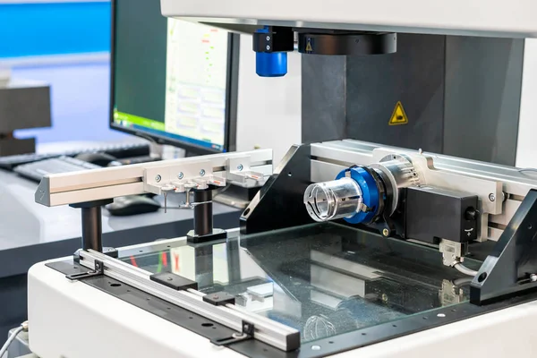 Metal workpiece during measuring by high technology and precision optic ...