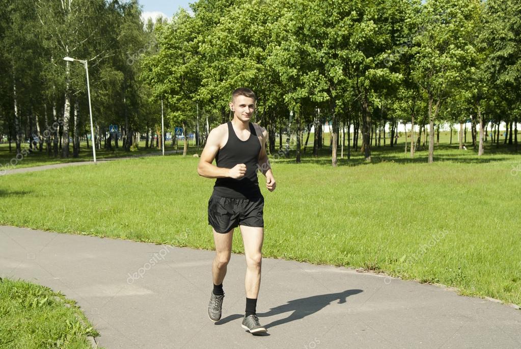 Guy running in the park — Stock Photo © m.ilias1987 #13628273