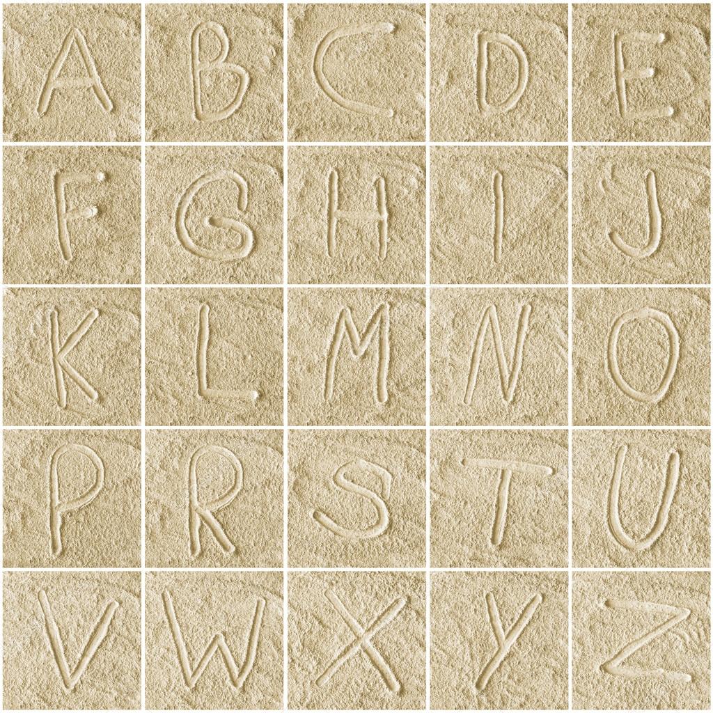 Handwritten alphabet letters on sand — Stock Photo © mankukuku #44104103