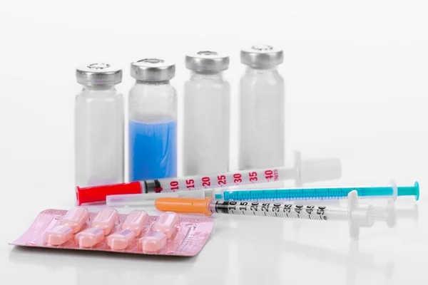 Pharmacology tablets vials syringes Stock Photo by ©Inna_Astakhova 43327477