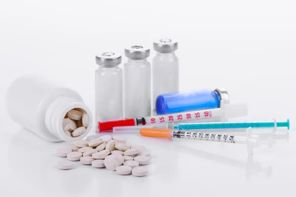Pharmacology tablets vials syringes Stock Photo by ©Inna_Astakhova 43327477