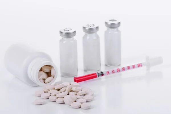 Pharmacology tablets vials syringes Stock Photo by ©Inna_Astakhova 43327477