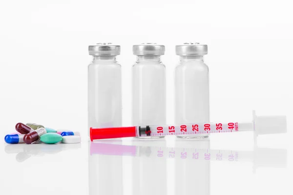 Pharmacology tablets vials syringes Stock Photo by ©Inna_Astakhova 43327493