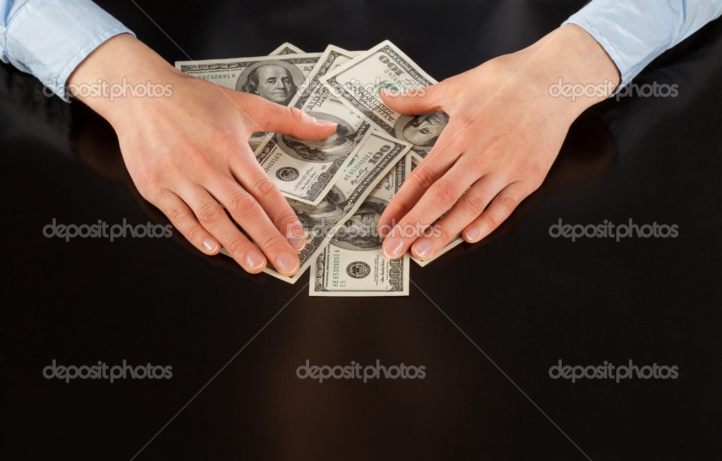 Hands and dollar banknotes — Stock Photo © zestmarina #23356600