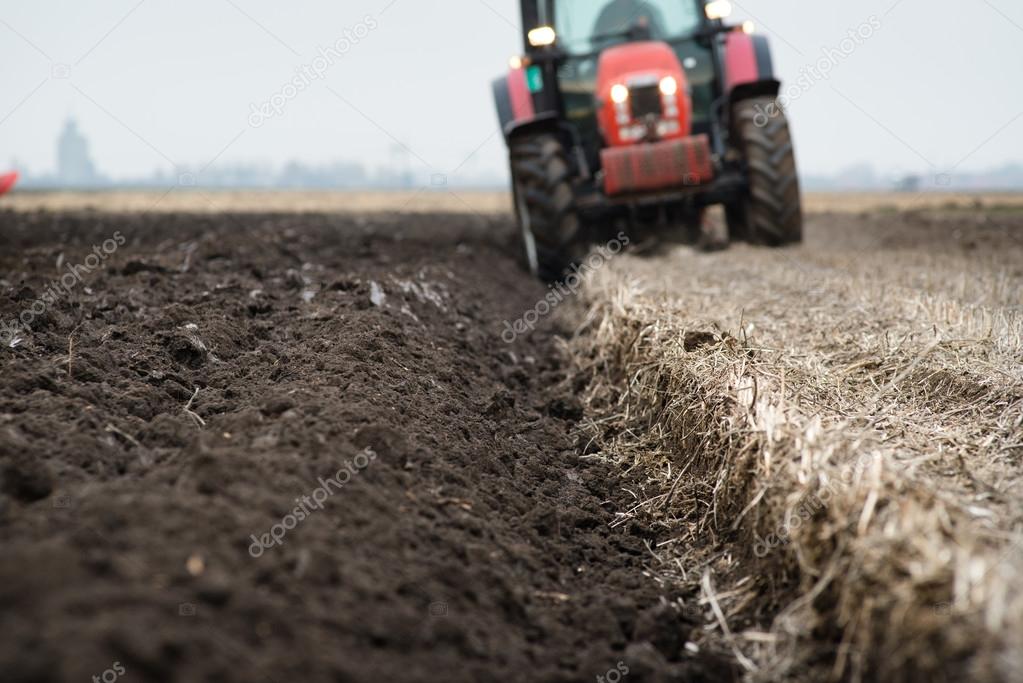 Tractor Plowing Stock Photo by ©fotokostic 15470307