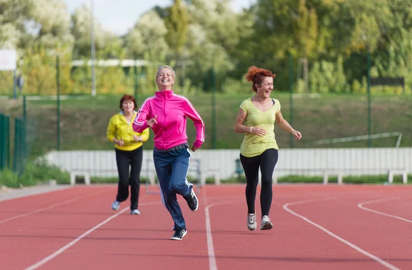 Athlete celebrates race win at finish line — Stock Photo ...