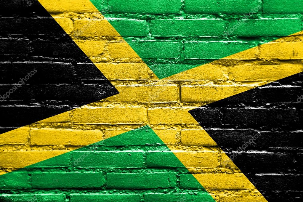 Jamaica Flag painted on brick wall — Stock Photo © PromesaStudio #51597613