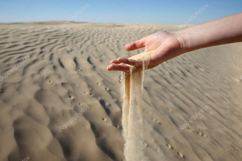 Woman hand in the sand Stock Photo by ©GoranJakus 41826867