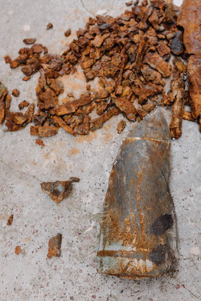 Fragments of a Russian artillery shell on the asphalt. Consequences of ...