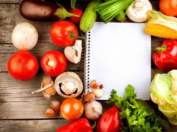 Open Notebook and Fresh Vegetables Background. Diet - Stock Image ...