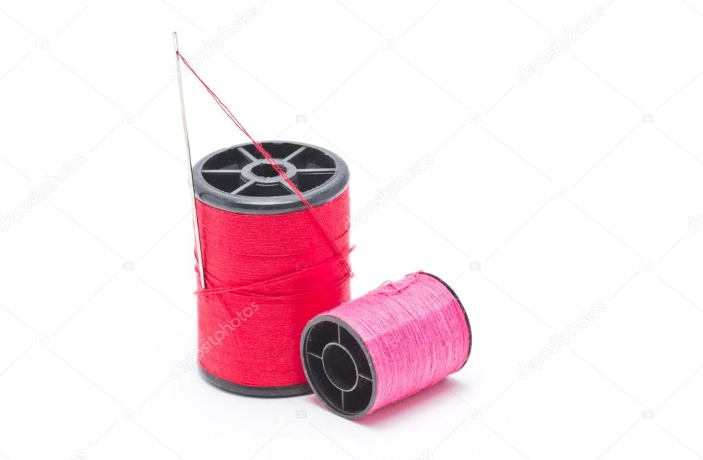 Spool of thread and needle isolated on white background. Stock Photo by ...