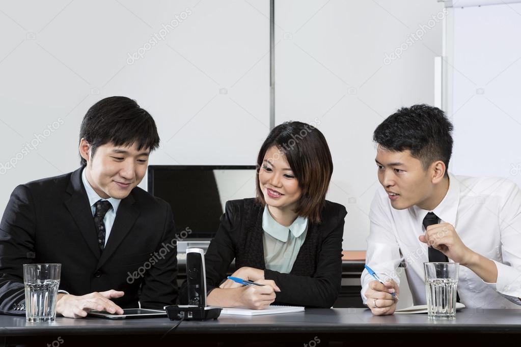Chinese Business team in conference call — Stock Photo © sjenner13 ...