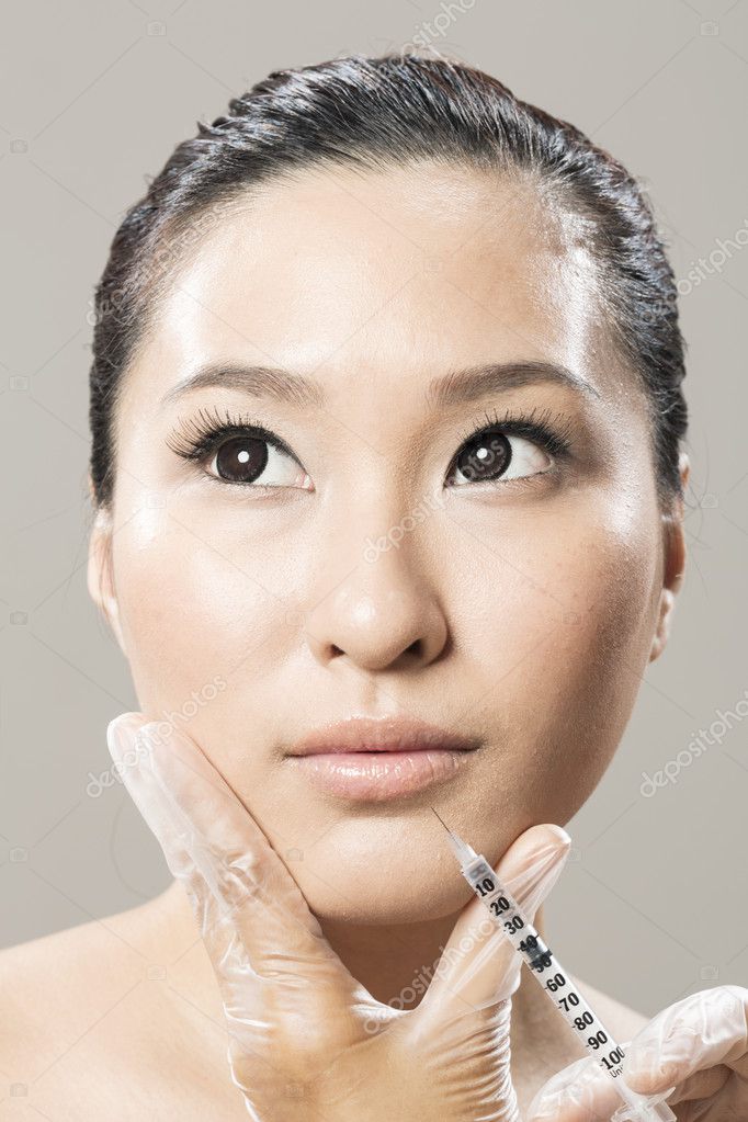 Chinese woman receiving a botox injection. — Stock Photo © sjenner13 ...
