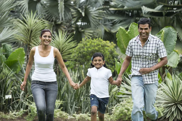 Happy indian family running together outdoors - Stock Image - Everypixel
